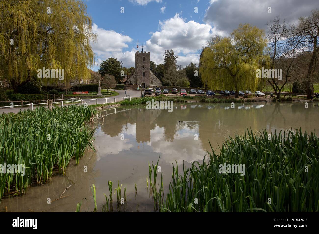 St Mary's Church sits on the edge of the pond in Buriton village, two ...