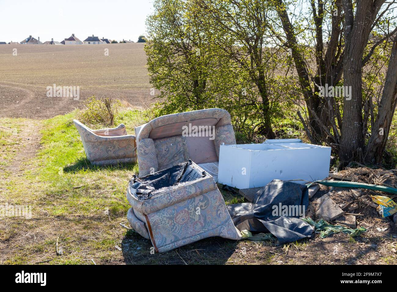 Dumped furniture in the countryside Stock Photo - Alamy