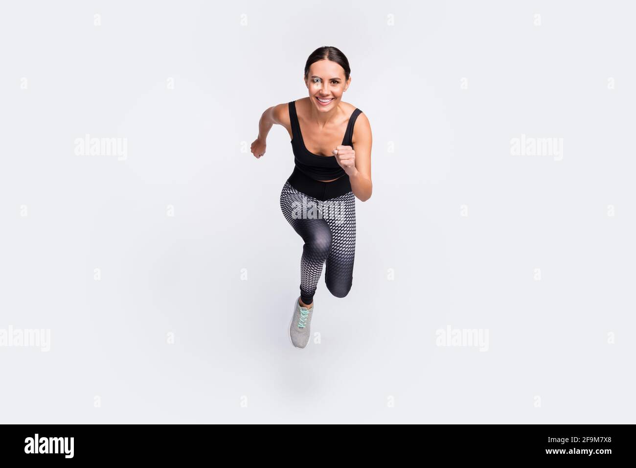 Full body photo of brown haired ponytail young woman jump up runner ...