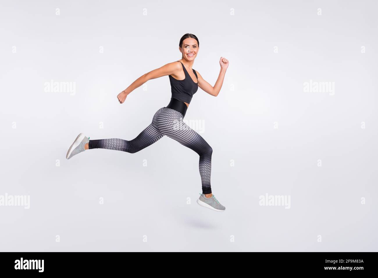 Full body profile side photo of brunette ponytail haired woman jump up ...