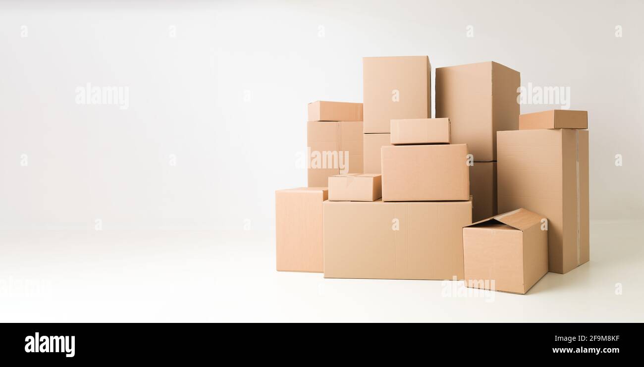 stack of cardboard boxes on white background Stock Photo - Alamy