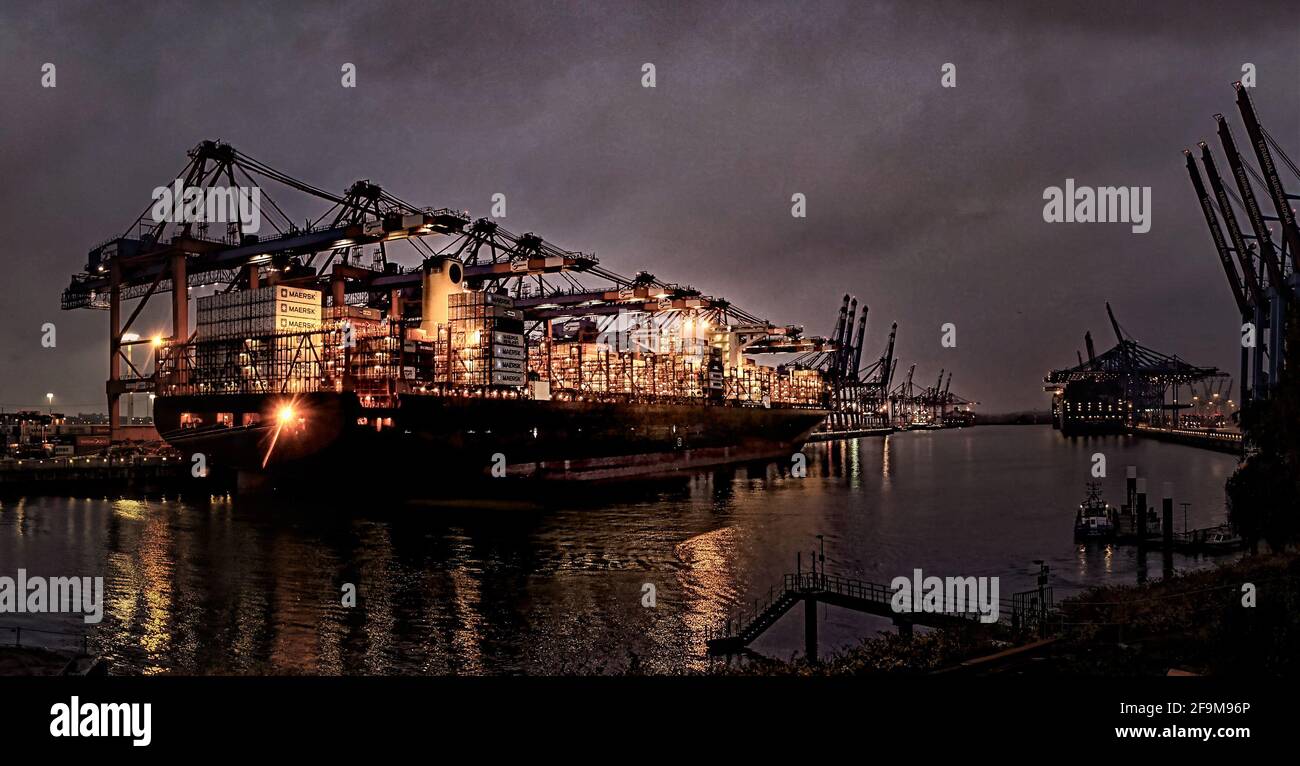 A modern container ship loading in the port of Hamburg Stock Photo - Alamy