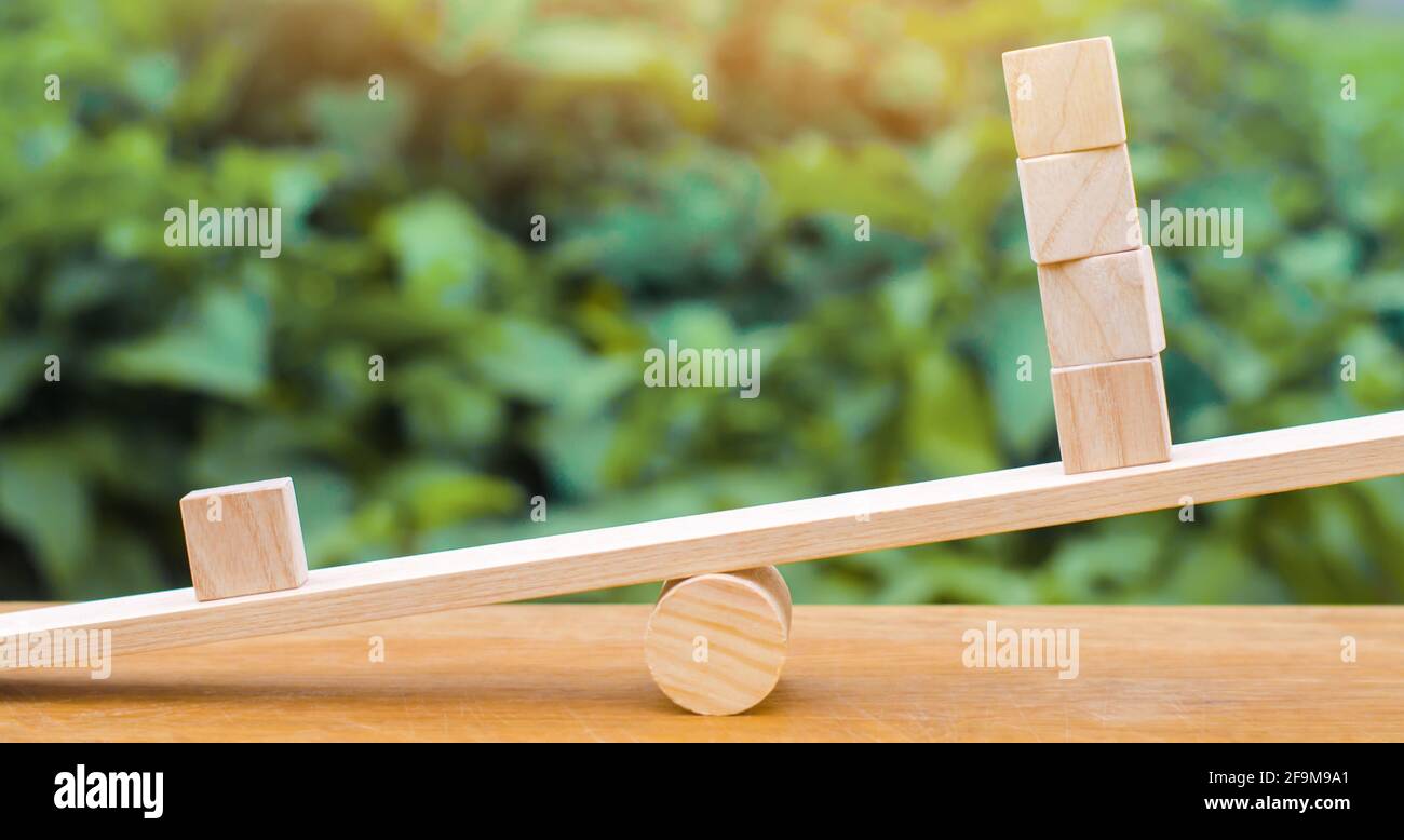 One wooden block on the scales outweighs the other four. Inequality ...