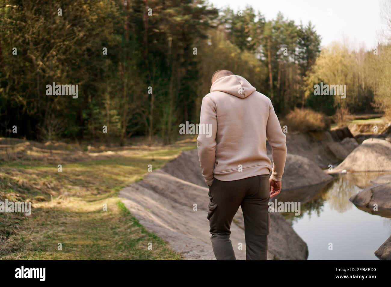 Back view male tourist walks hi-res stock photography and images - Alamy