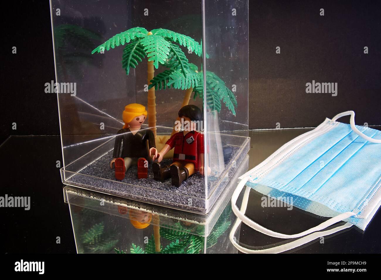 conceptual photo: A couple enjoy their holidays in the tropics locked ...