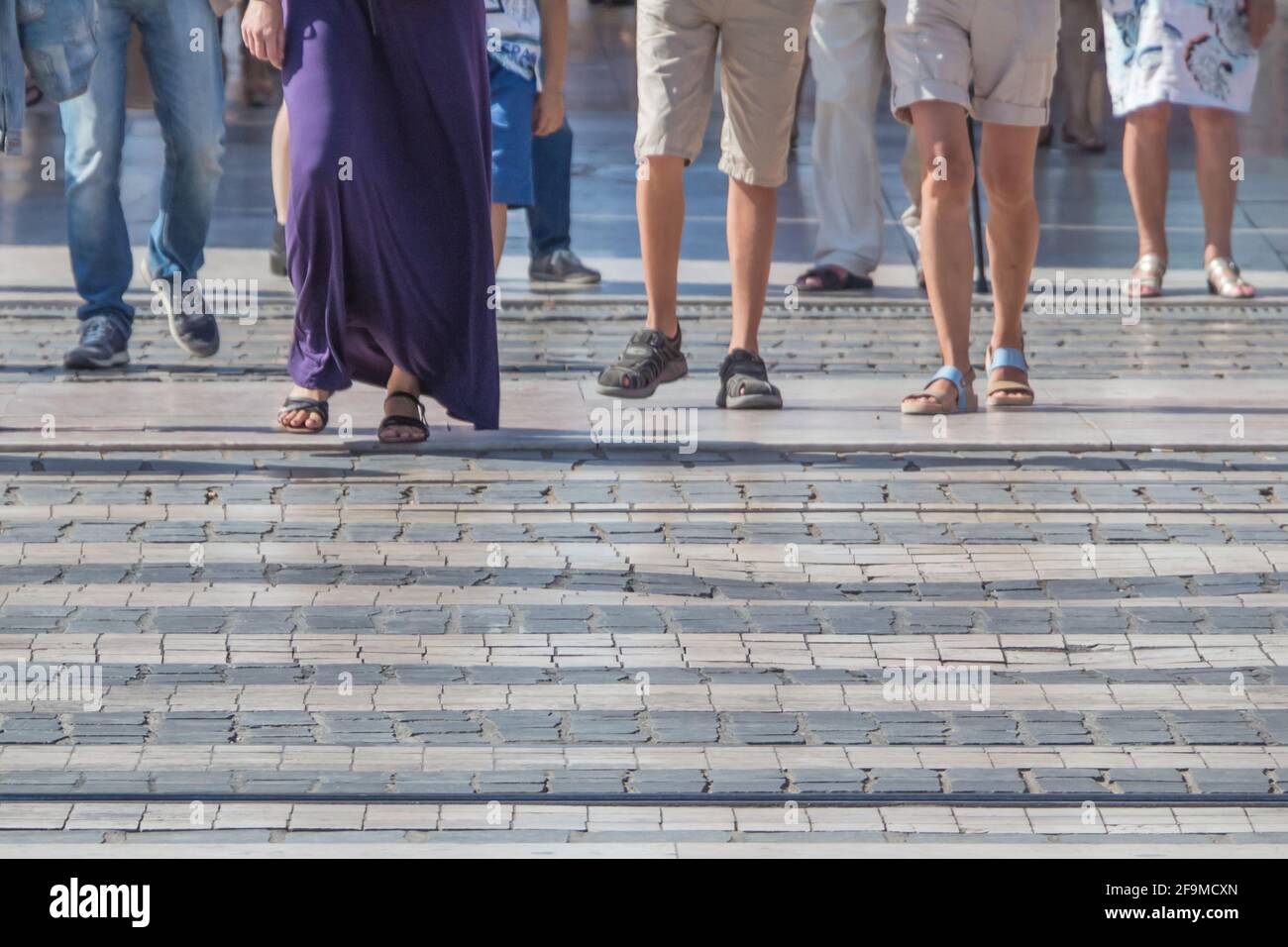 Pedestrian crossing downtown city crowd walk in motion on road. Many ...