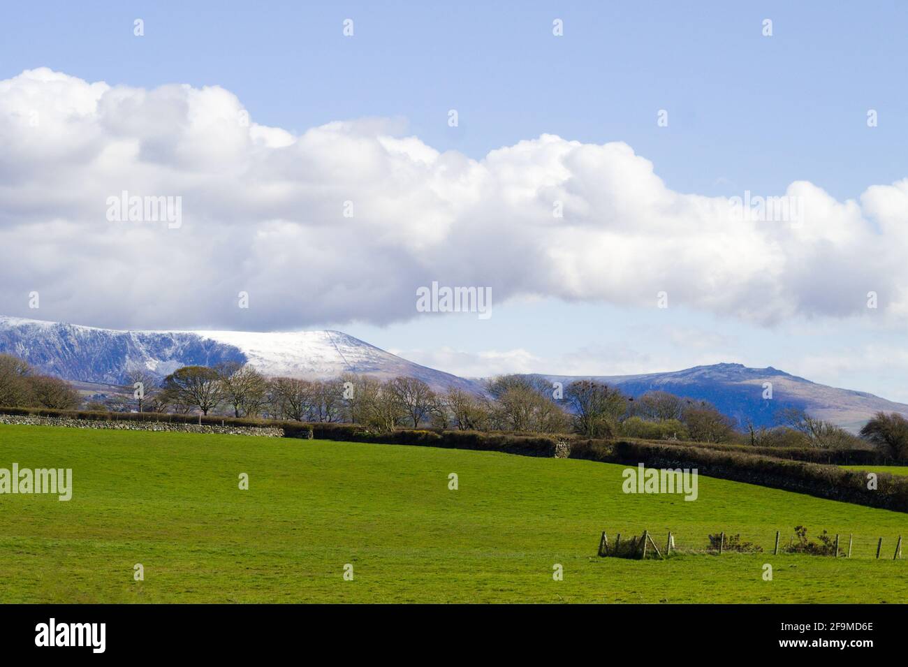 Snowdonia National park Dramatic landscape with gentle green fields in ...