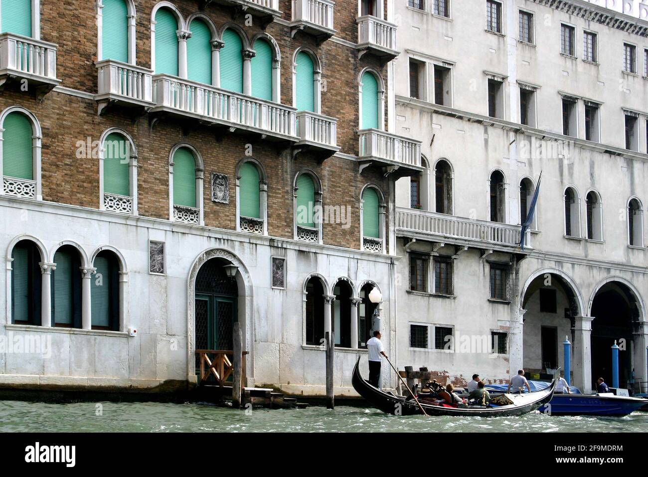 Venice, Italy. Tourists in gondola on the Grand Canal. Centuries-old ...