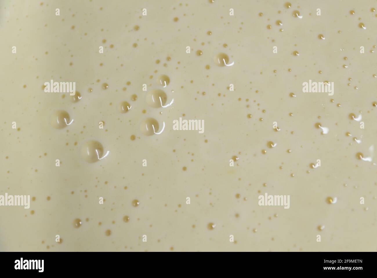 Batter texture with bubbles for biscuit. Dough close up. Cooking ...