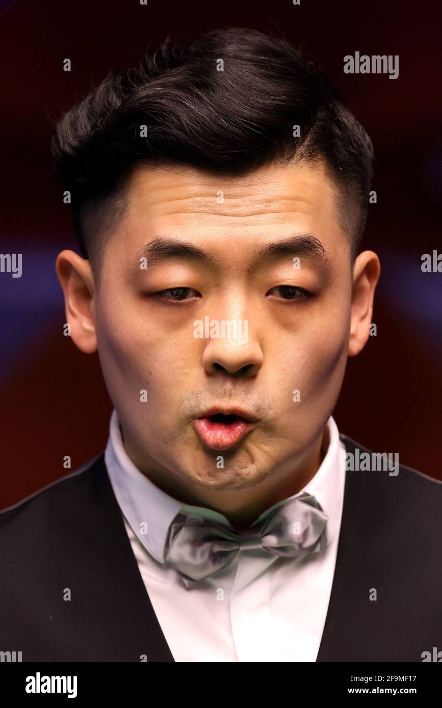 Tian Pengfei reacts during his match against John Higgins on day three ...