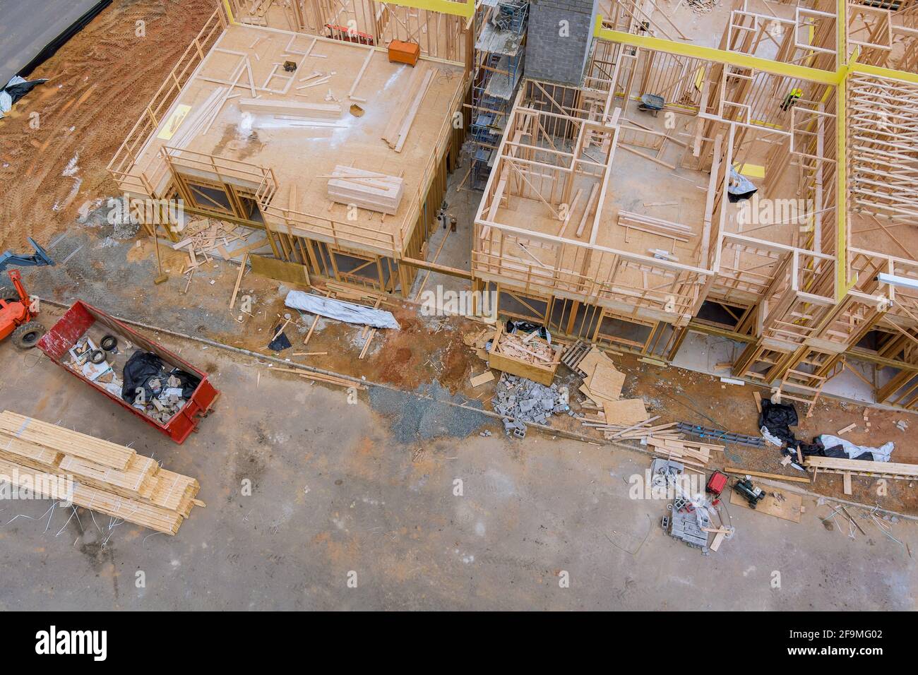 Aerial view of big construction dumpster on stacker wooden material ...