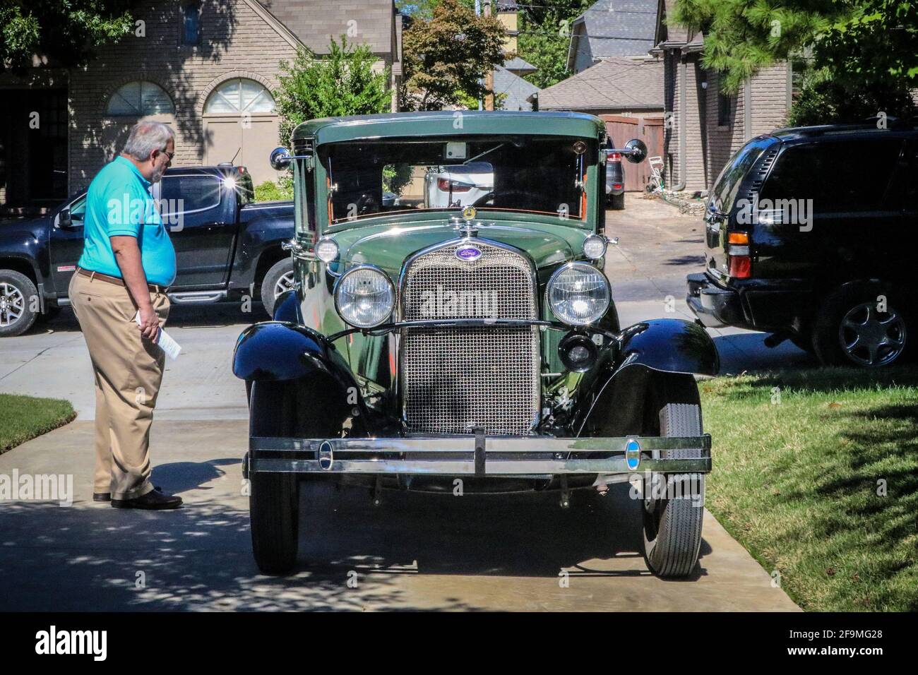 10-08-2017 Tulsa USA - Man looks over vintage Ford Model T in driveway ...