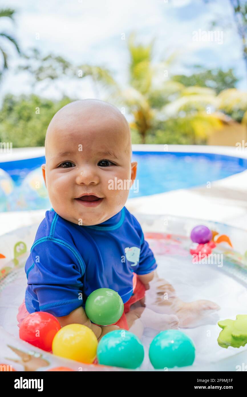 Beautiful Baby Playing In Pool Stock Photo - Alamy