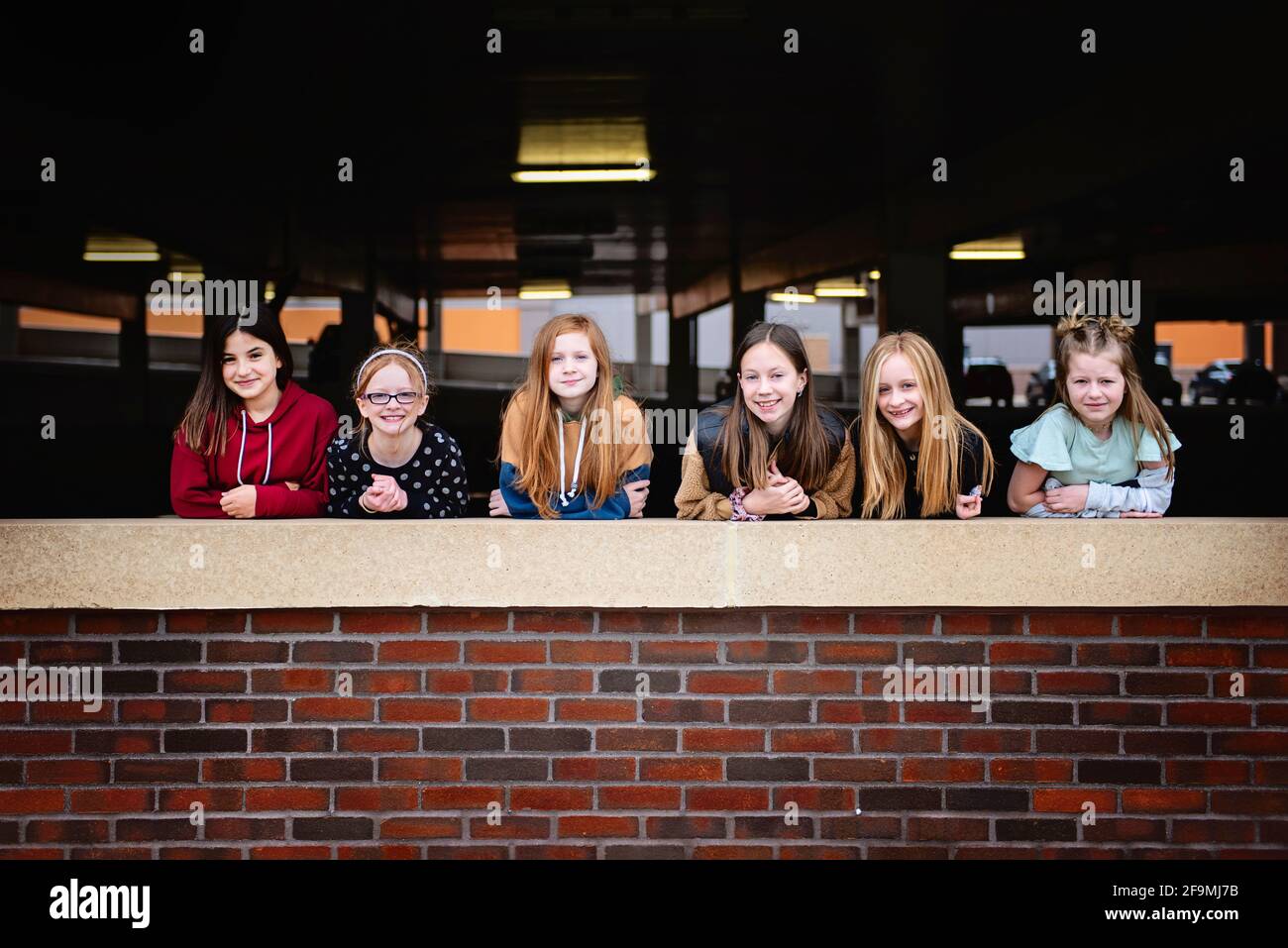 Group of 6 cute Tween girls hanging out having fun in the city Stock ...