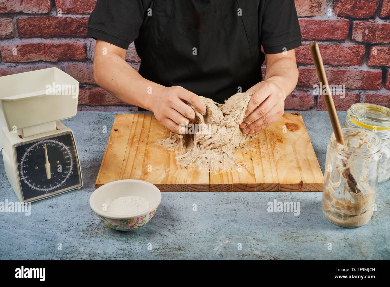 Baker kneading dough for the preparation of artisan bread Stock Photo ...
