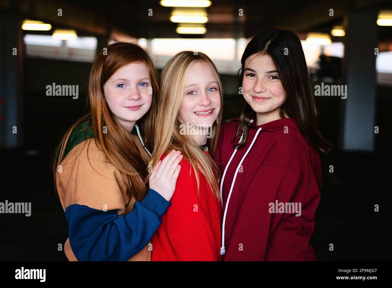 Three cute and happy tween girls standing together Stock Photo - Alamy
