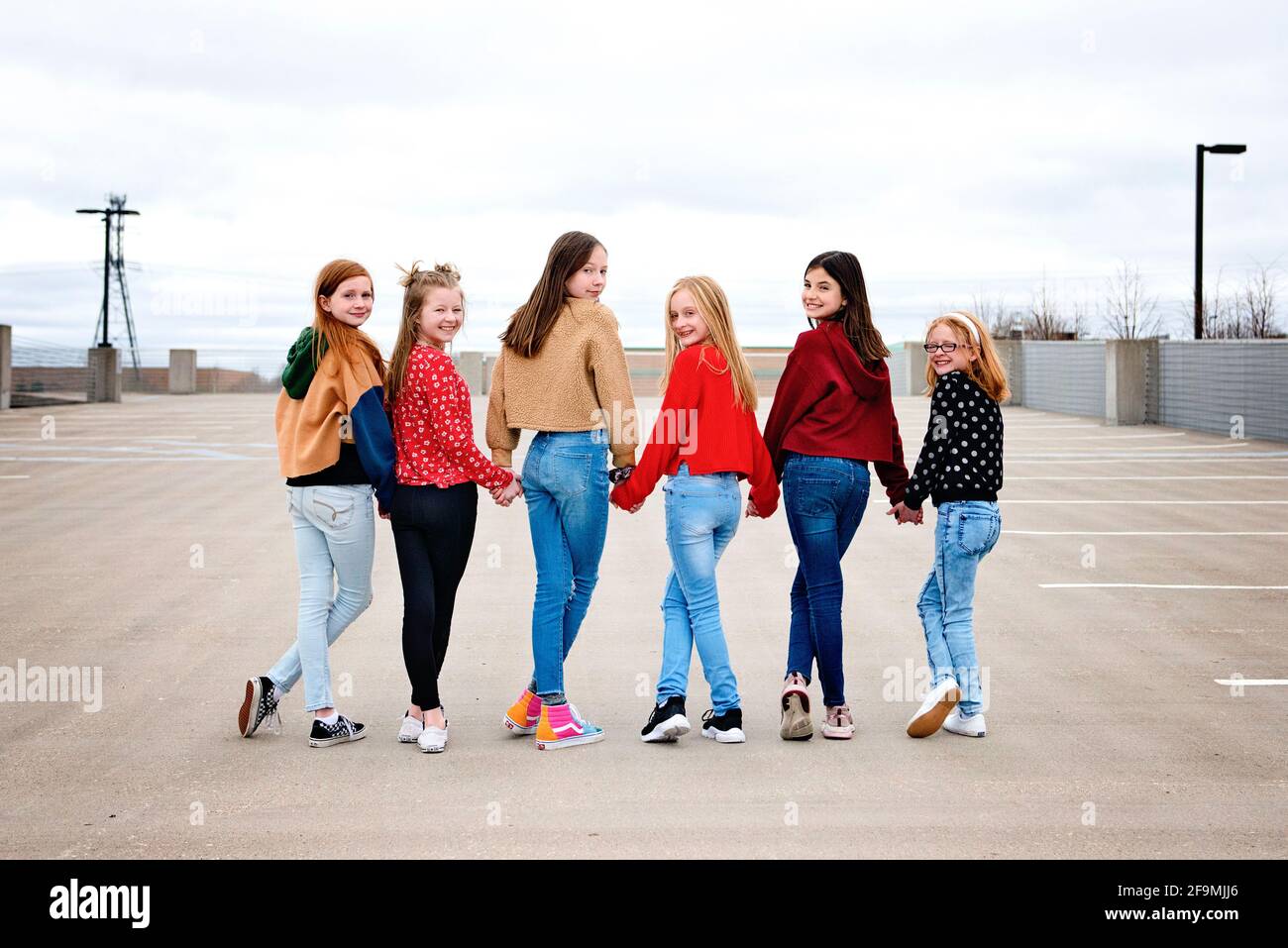Group of 6 cute Tween girls hanging out having fun in the city Stock ...