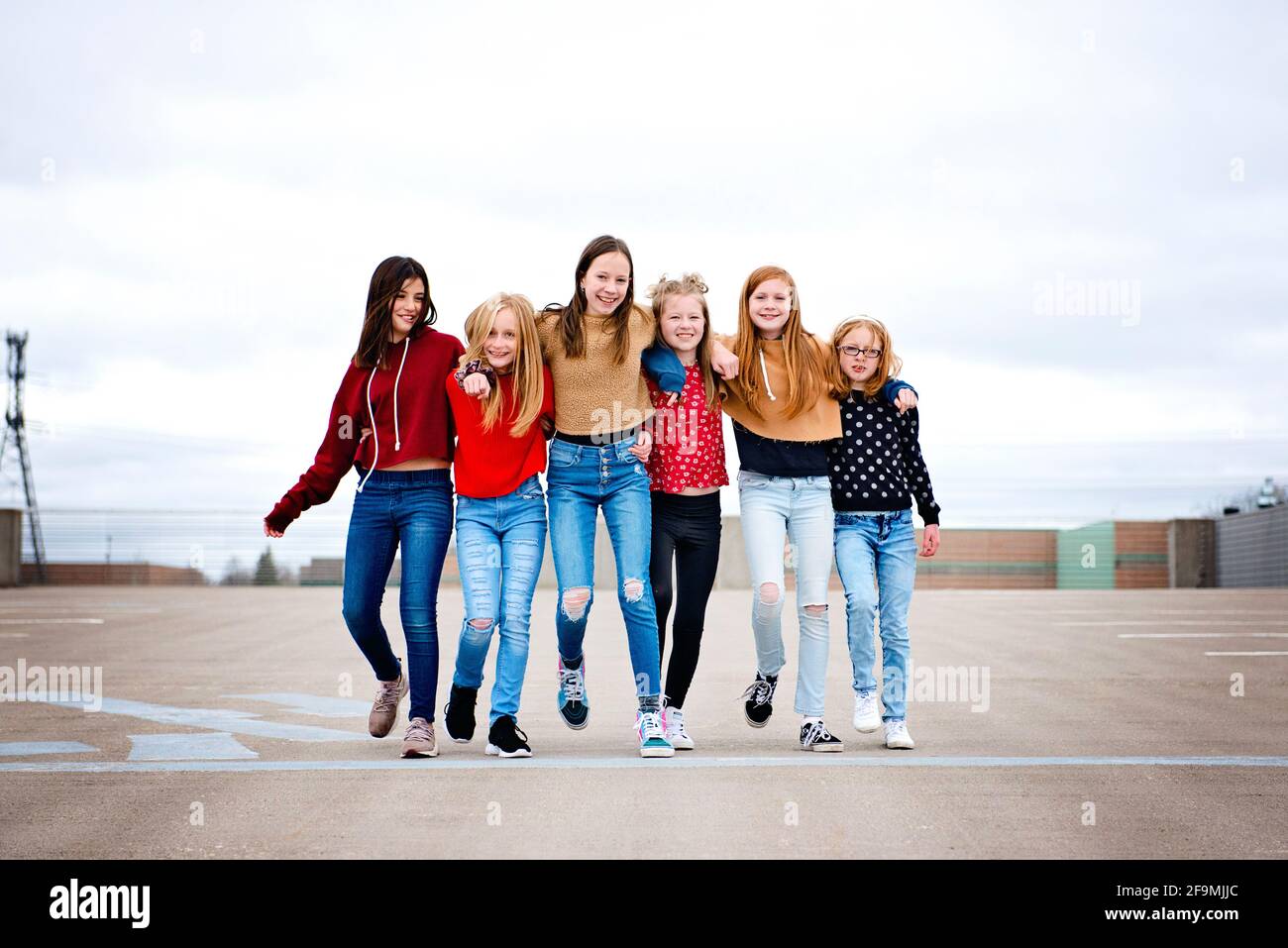 Group of 6 cute Tween girls hanging out having fun in the city Stock ...