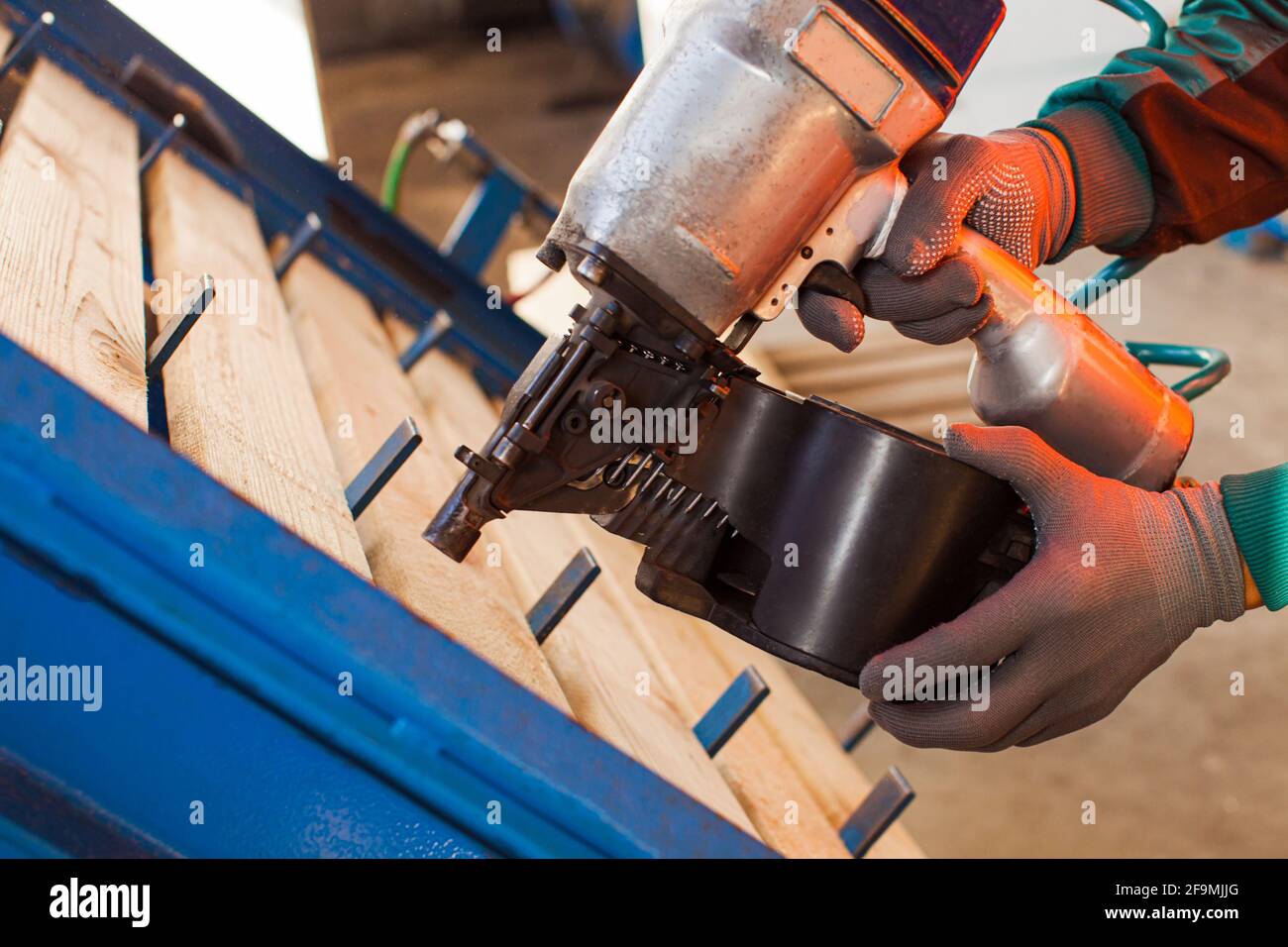 Carpenter man at woodworking factory working place Stock Photo - Alamy