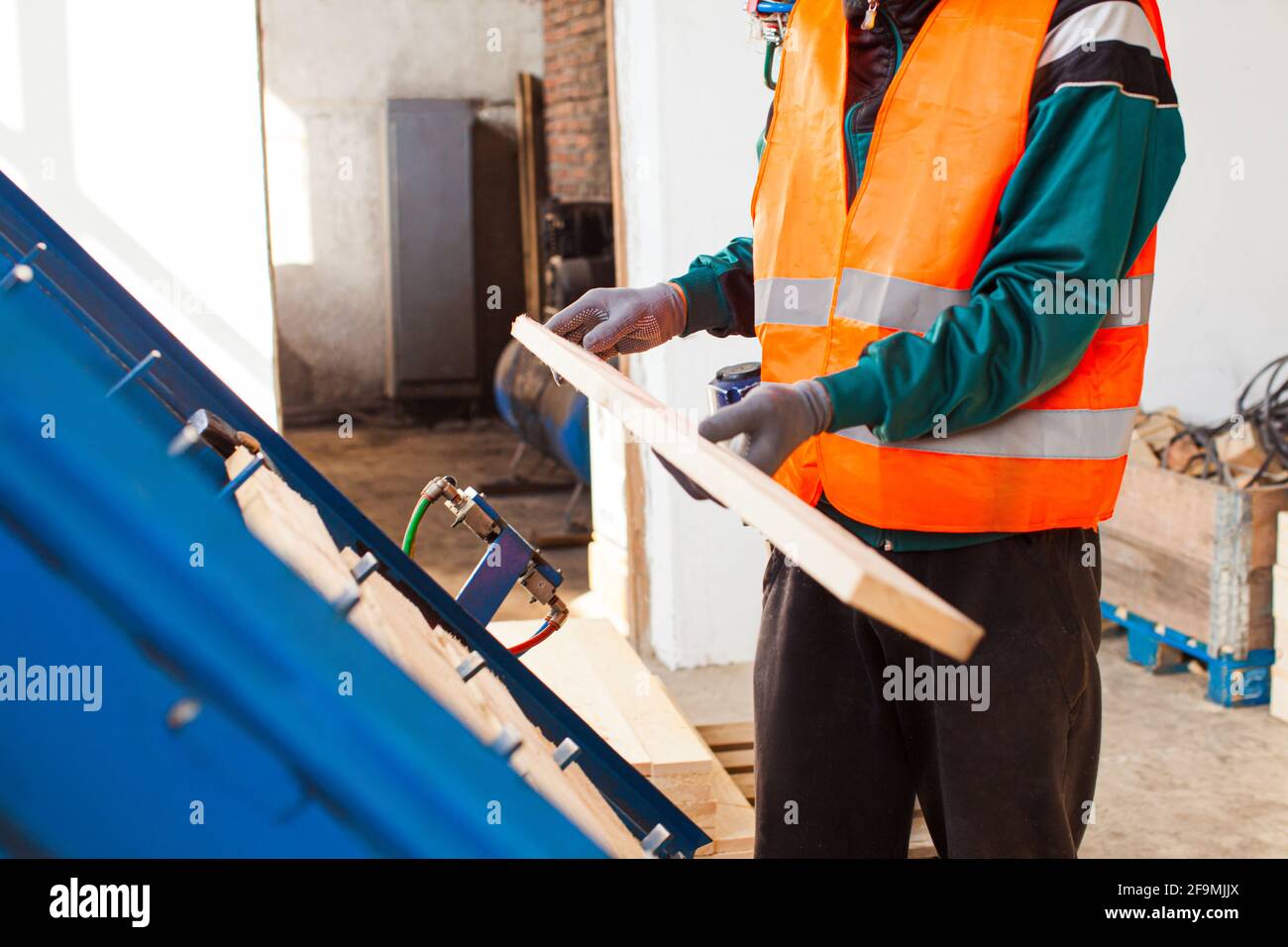 Carpenter man at woodworking factory working place Stock Photo - Alamy