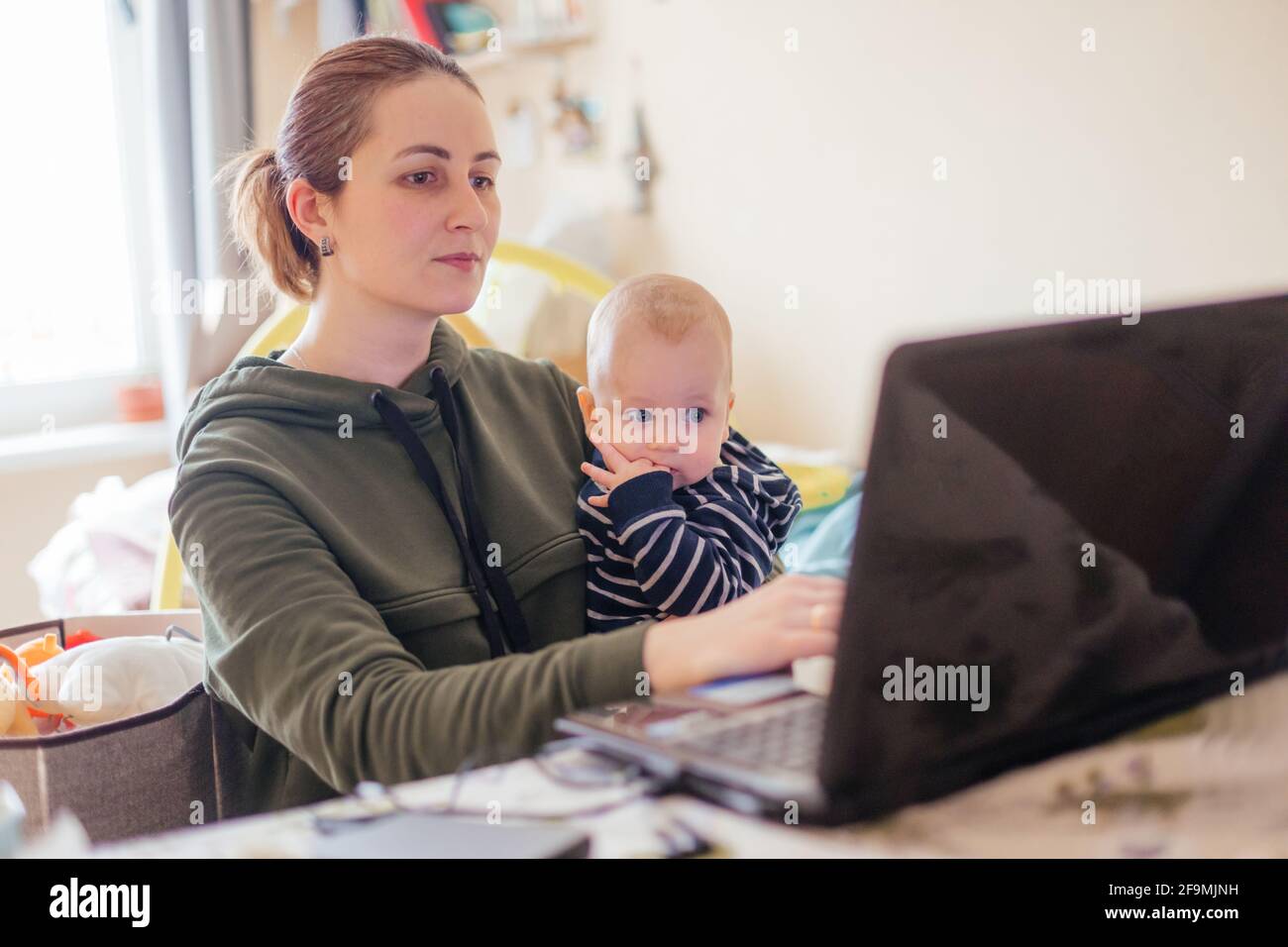 Woman baby computer hi-res stock photography and images - Alamy