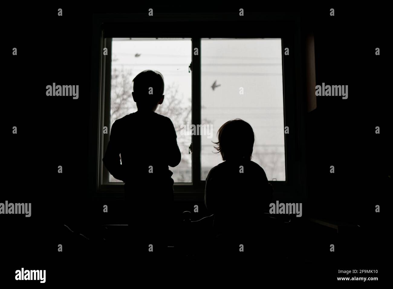 Children playing out the window hi-res stock photography and images - Alamy