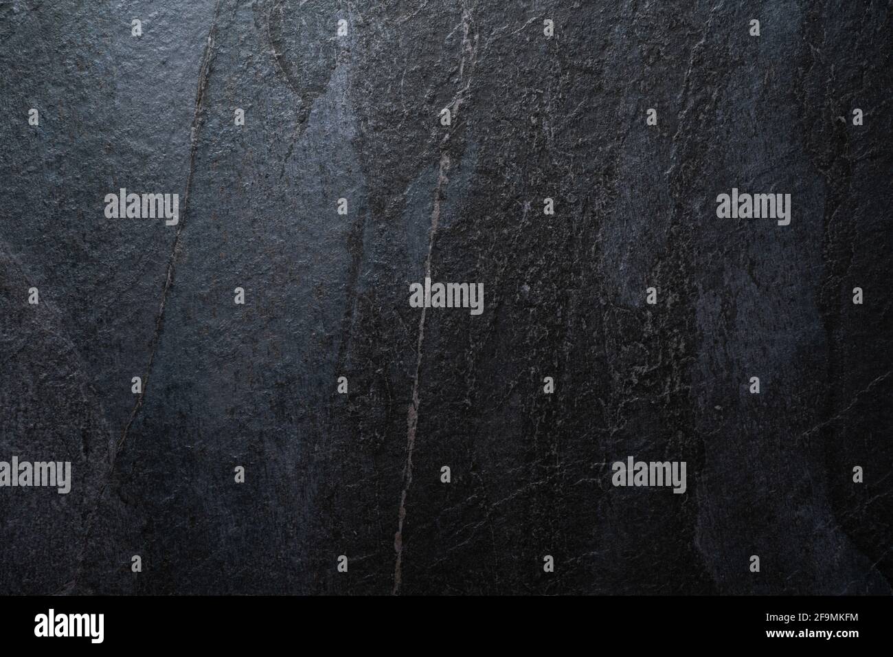 dark gray and blue natural stone background. abstract texture with ...