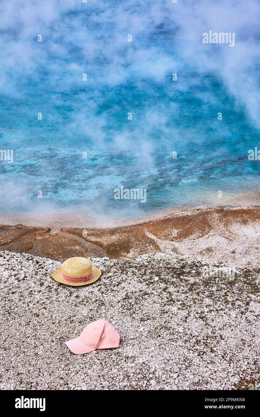 Excelsior Geyser with lost straw hat and base cap in Yellowstone Park ...