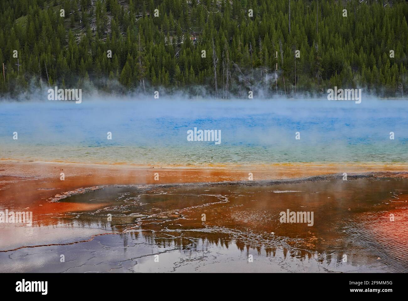 Prismatic pool with colored earth and hot water in Yellowstone Park ...