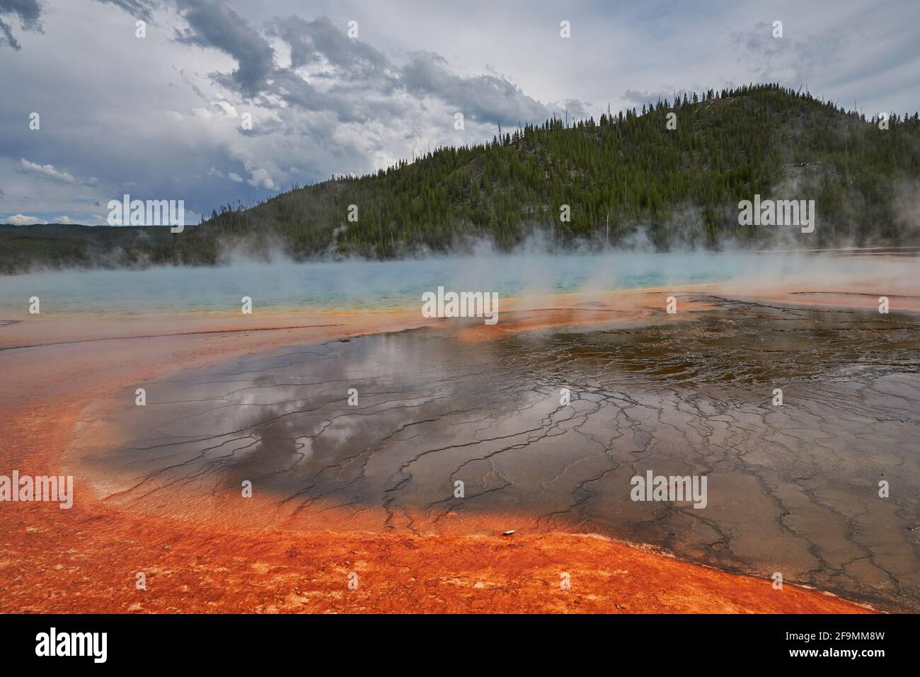 Prismatic pool with colored earth and hot water in Yellowstone Park ...
