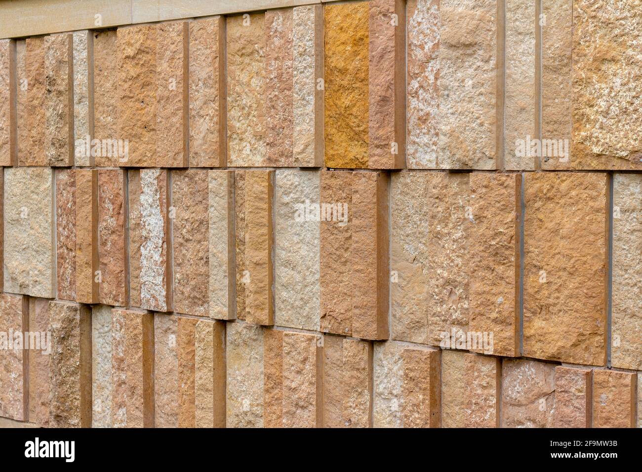 Modern rough textured limestone wall background with attractive ...