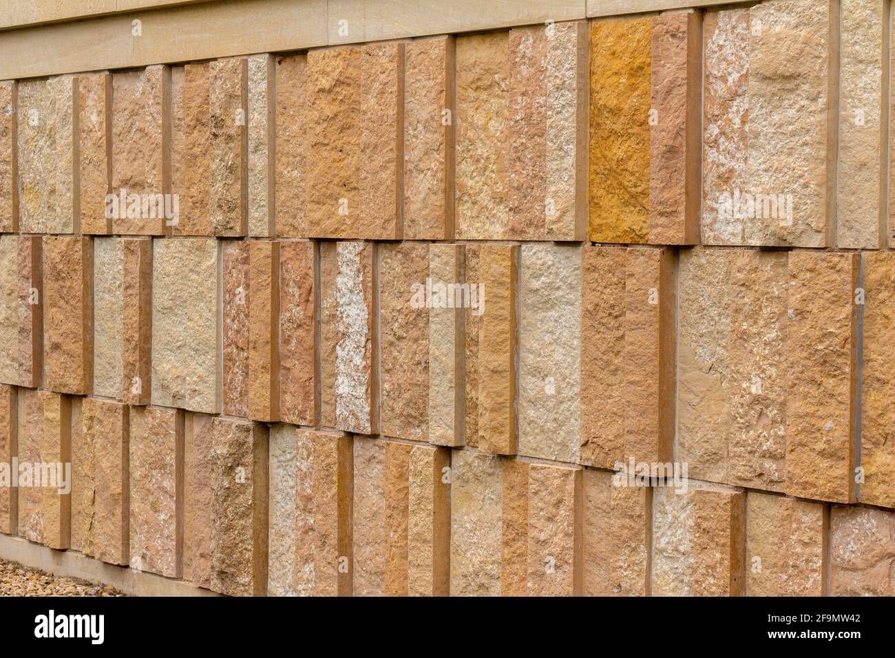 Modern rough textured limestone wall background with attractive ...