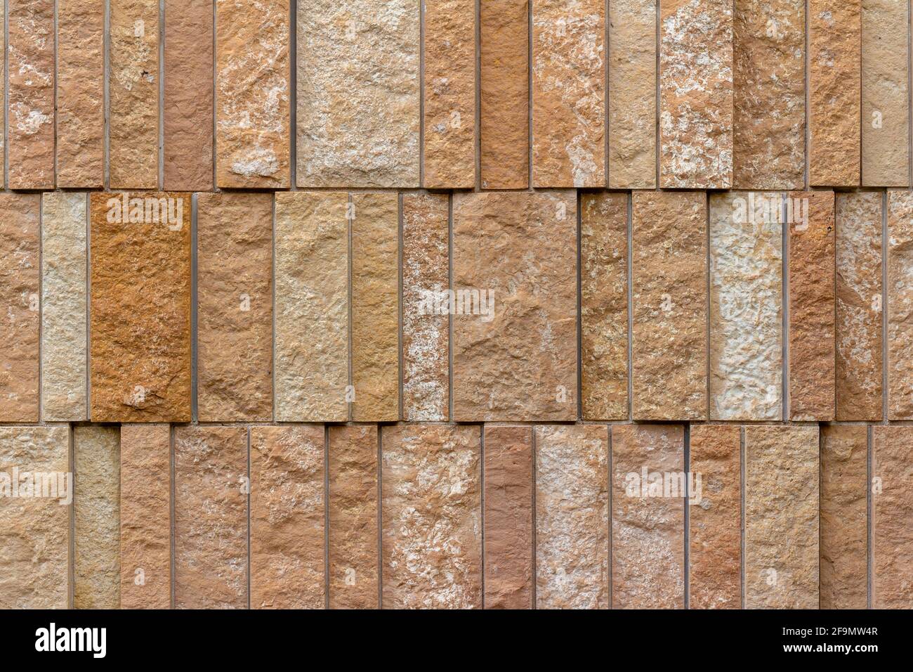 Modern rough textured limestone wall background with attractive ...