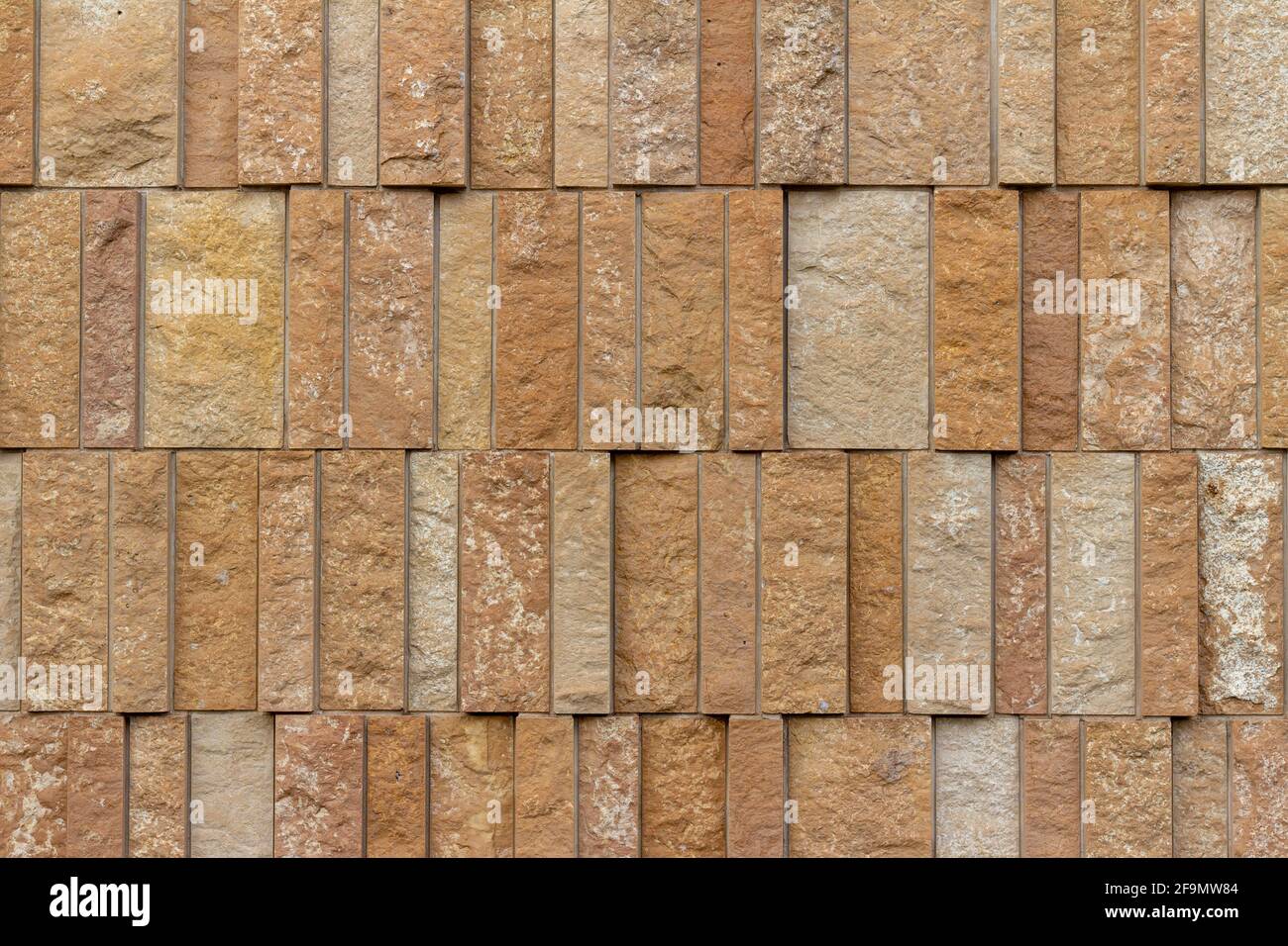 Modern rough textured limestone wall background with attractive ...