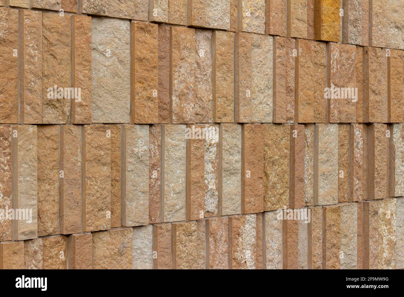 Modern rough textured limestone wall background with attractive ...