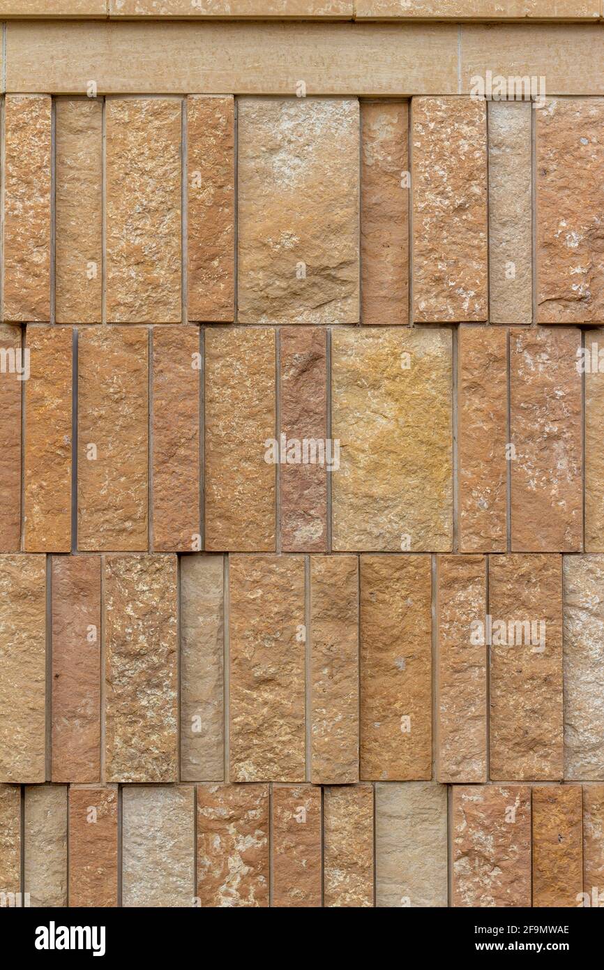 Modern rough textured limestone wall background with attractive ...