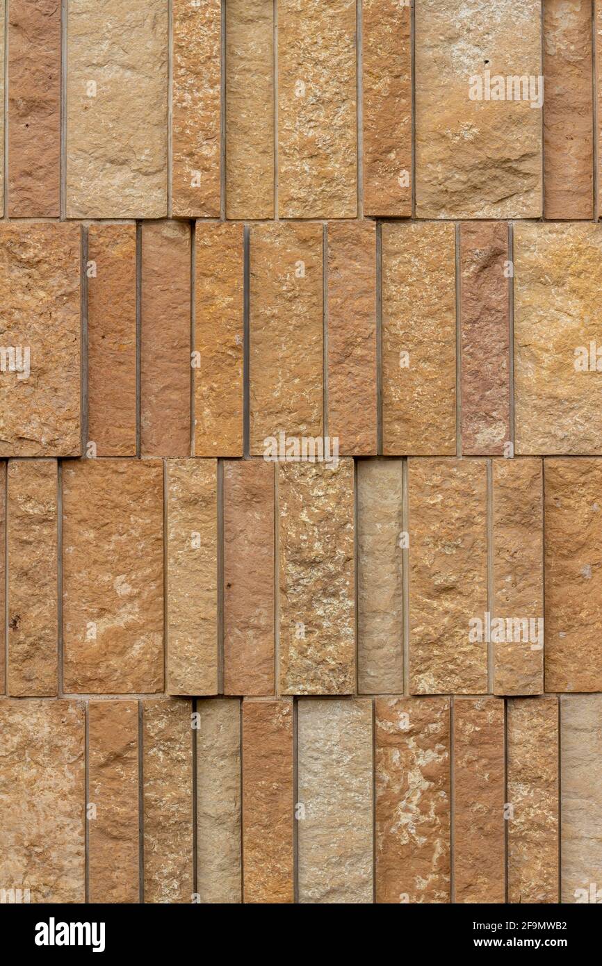 Modern rough textured limestone wall background with attractive ...