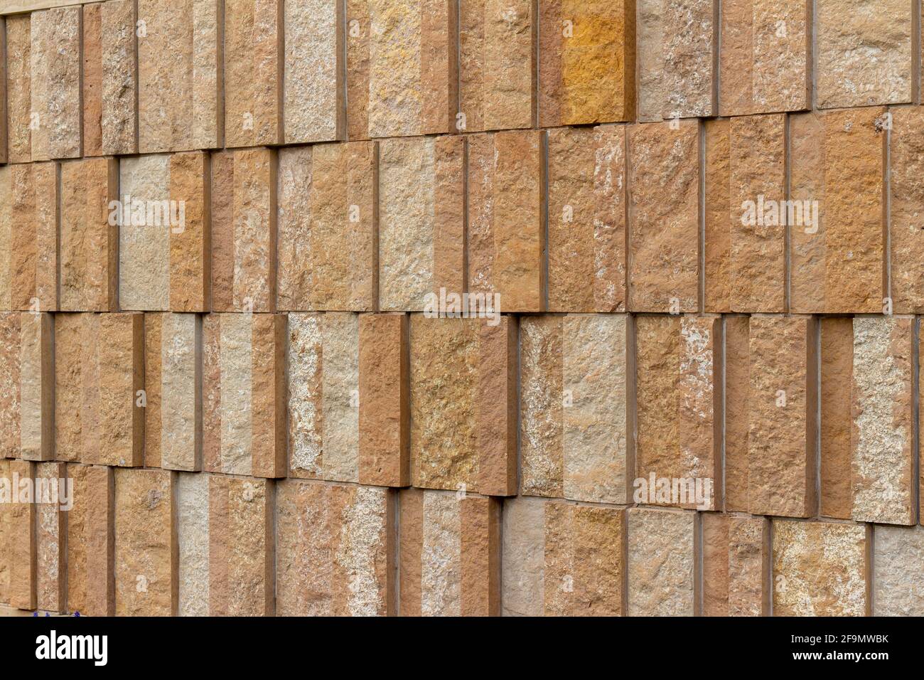 Modern rough textured limestone wall background with attractive ...