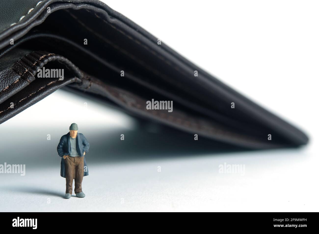 Poor men with empty wallet no money cash. Miniature tiny people toys ...