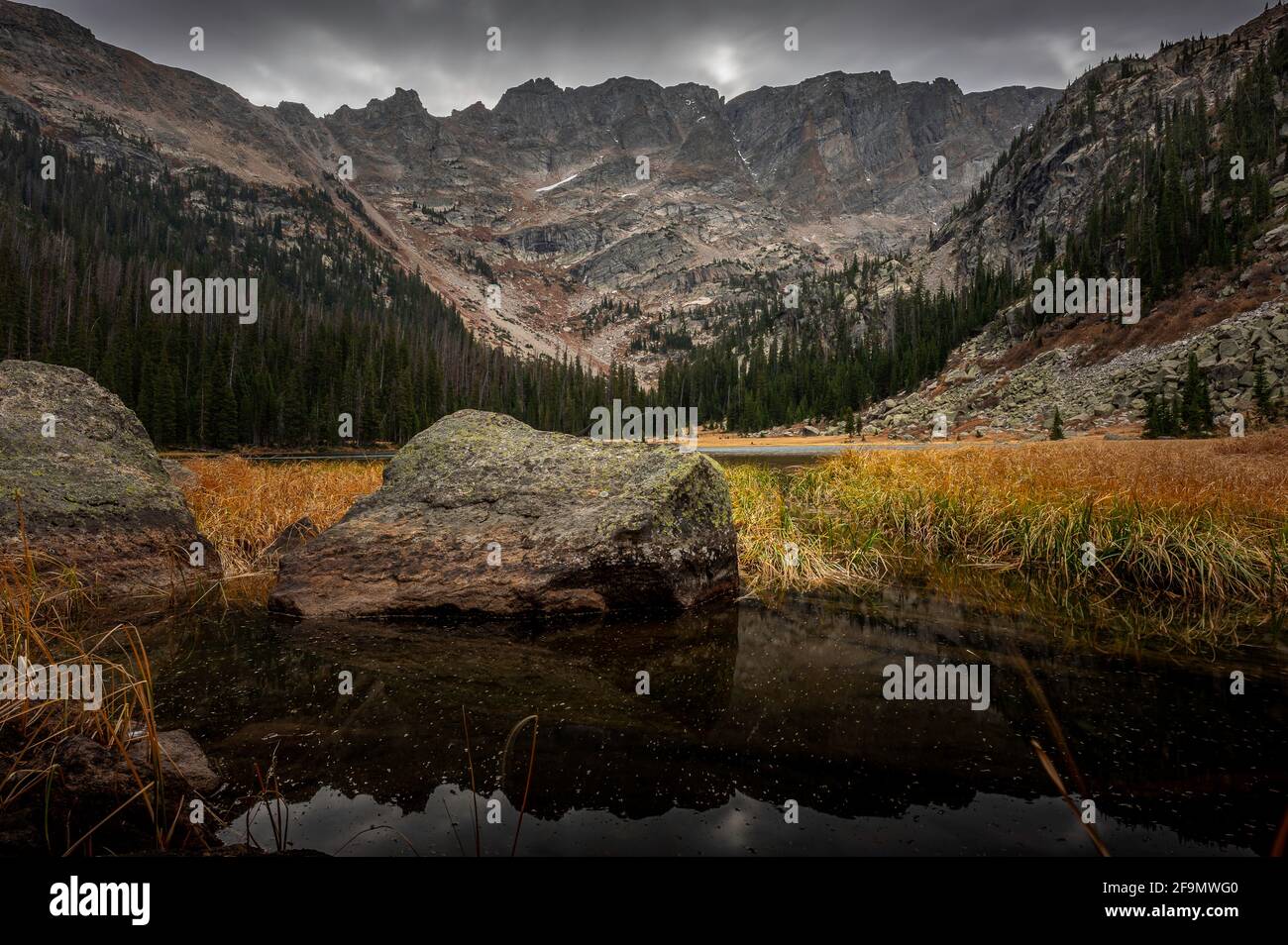 West shore of Fourth Lake with views of the continental divide in Rocky ...