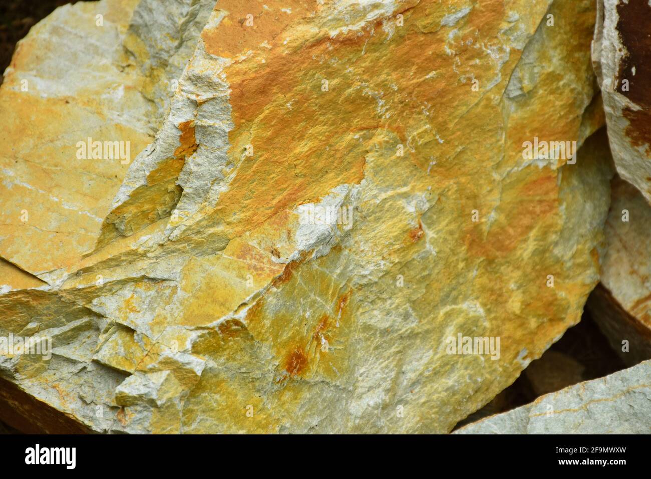 Igneous Rock with yellow and white pattern Stock Photo - Alamy