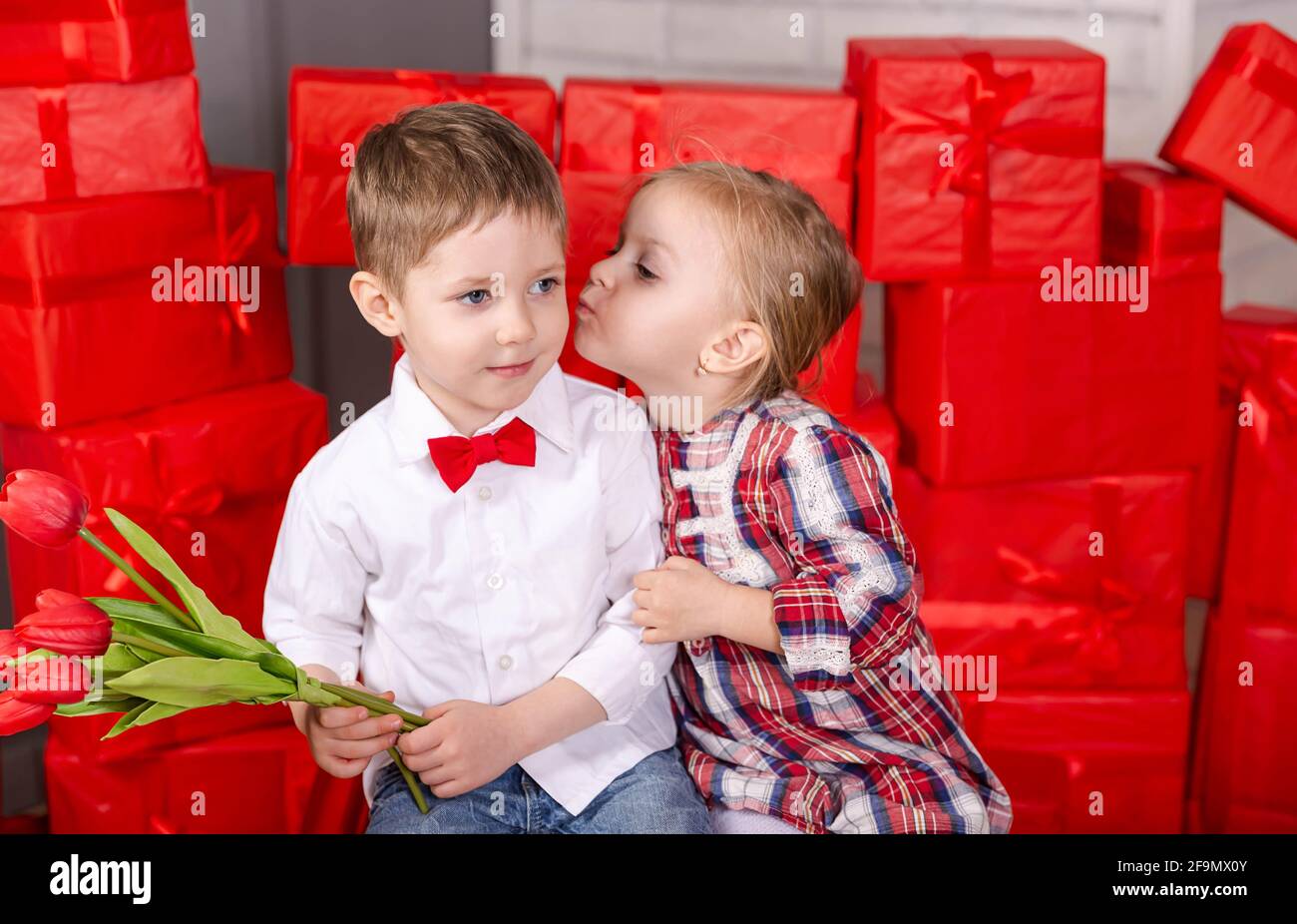 Couple of kids kissing each other. Romantic meeting of two children ...