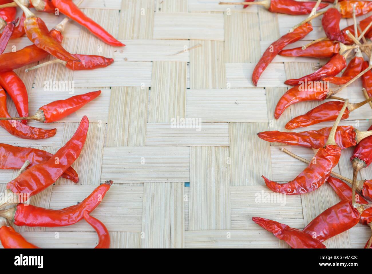 Whole dried red chili or hot pepper top view on natural background with ...