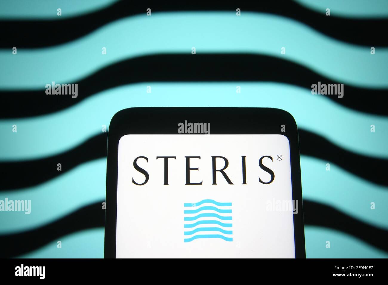 In this photo illustration a Steris logo of a medical equipment company ...