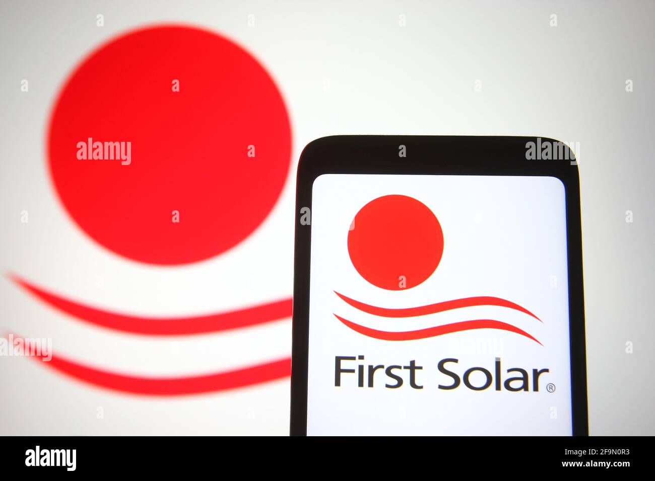 In this photo illustration a First Solar logo of an US solar company is ...