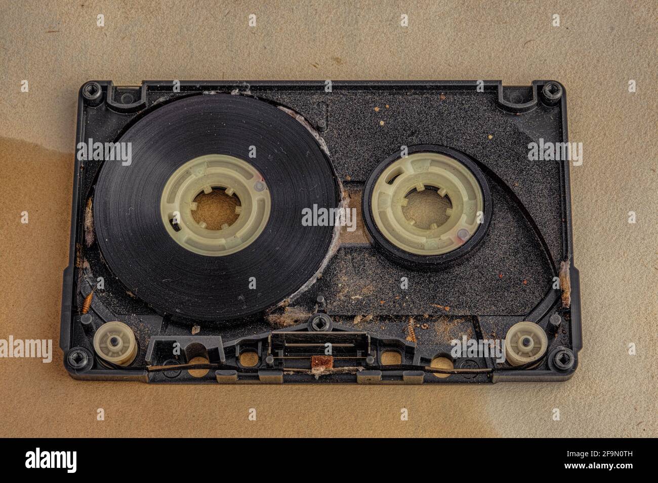 old dirty audio cassette tape on old paper background Stock Photo - Alamy
