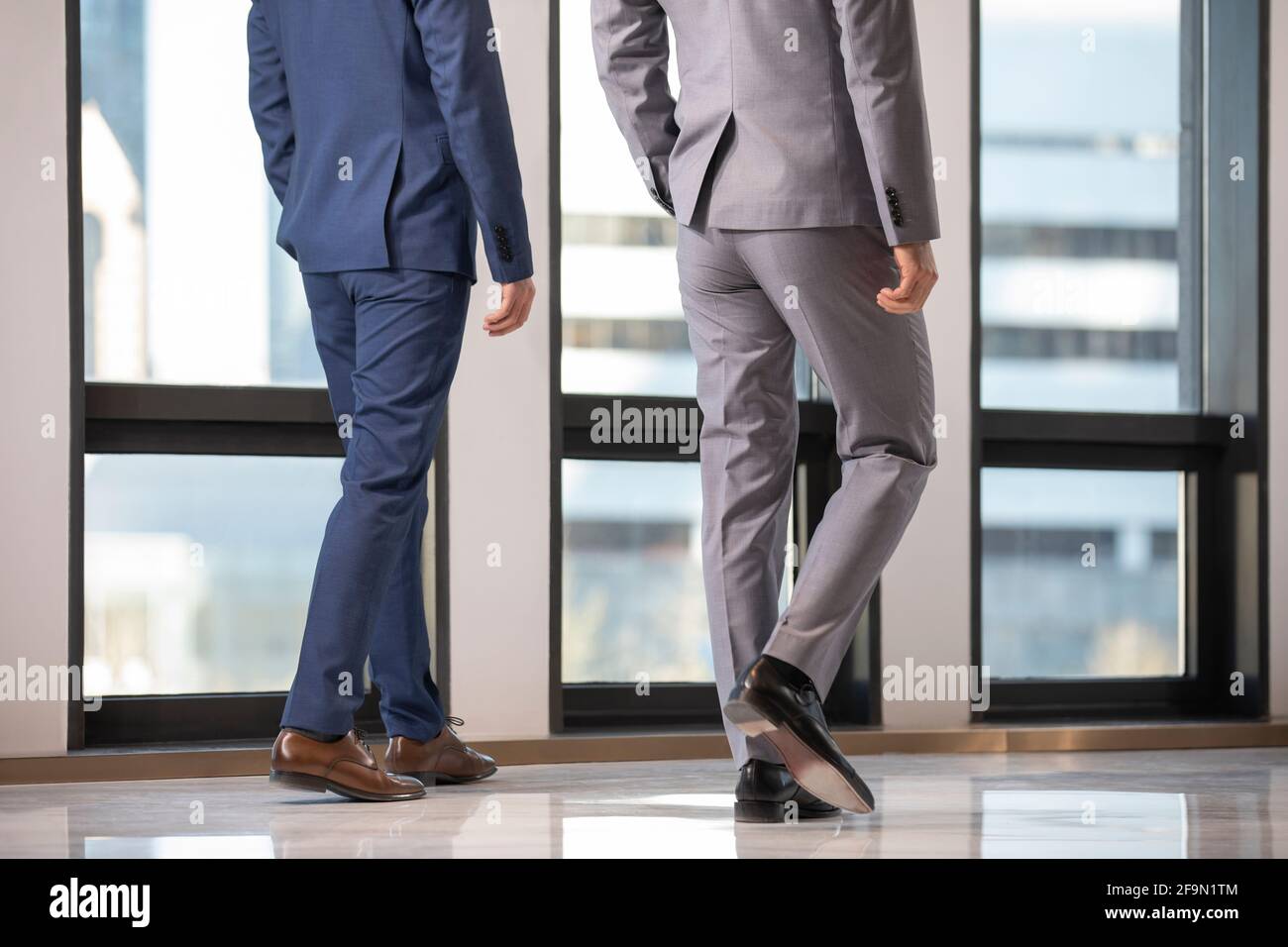 Successful businessmen walking Stock Photo - Alamy