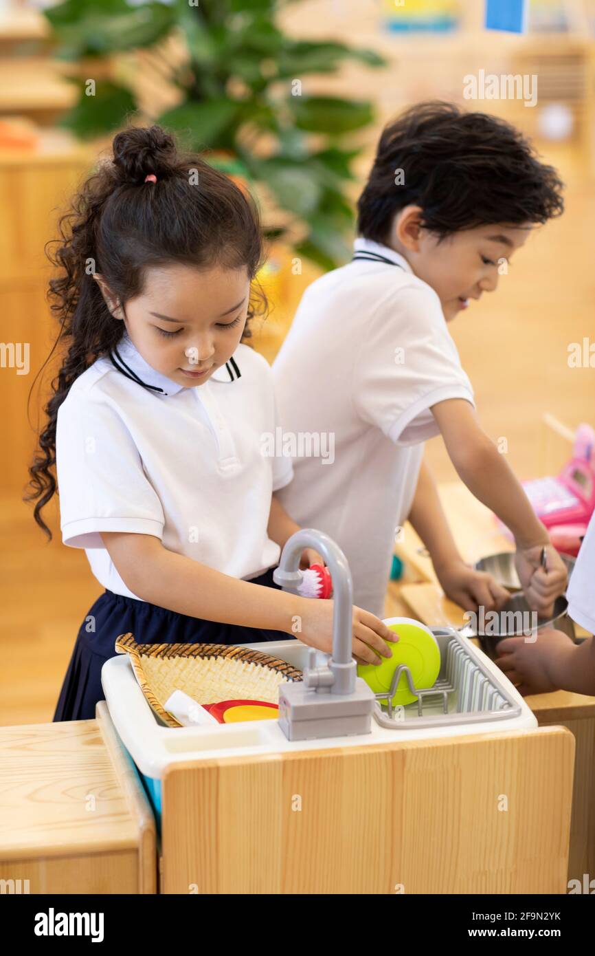 Children playing in classroom Stock Photo - Alamy