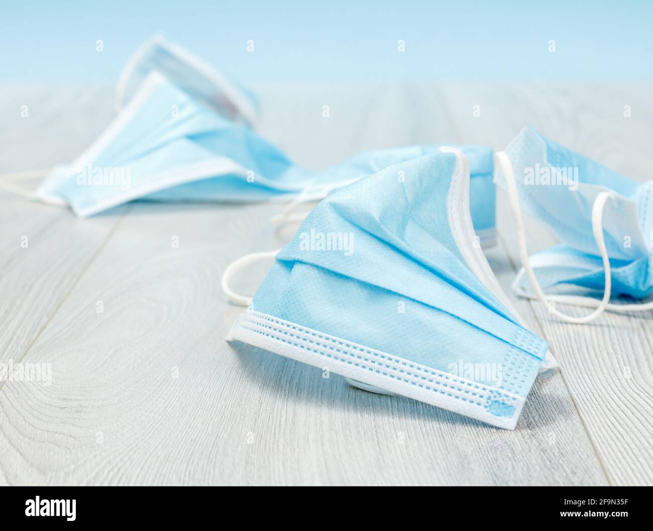 Used medical protective masks on a floor Stock Photo - Alamy