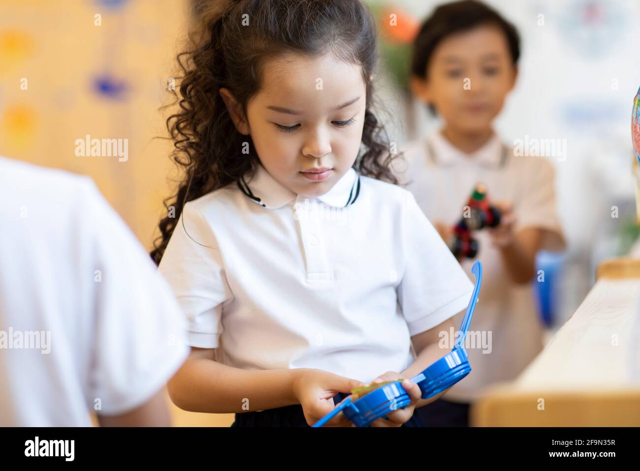 Children playing in classroom Stock Photo - Alamy
